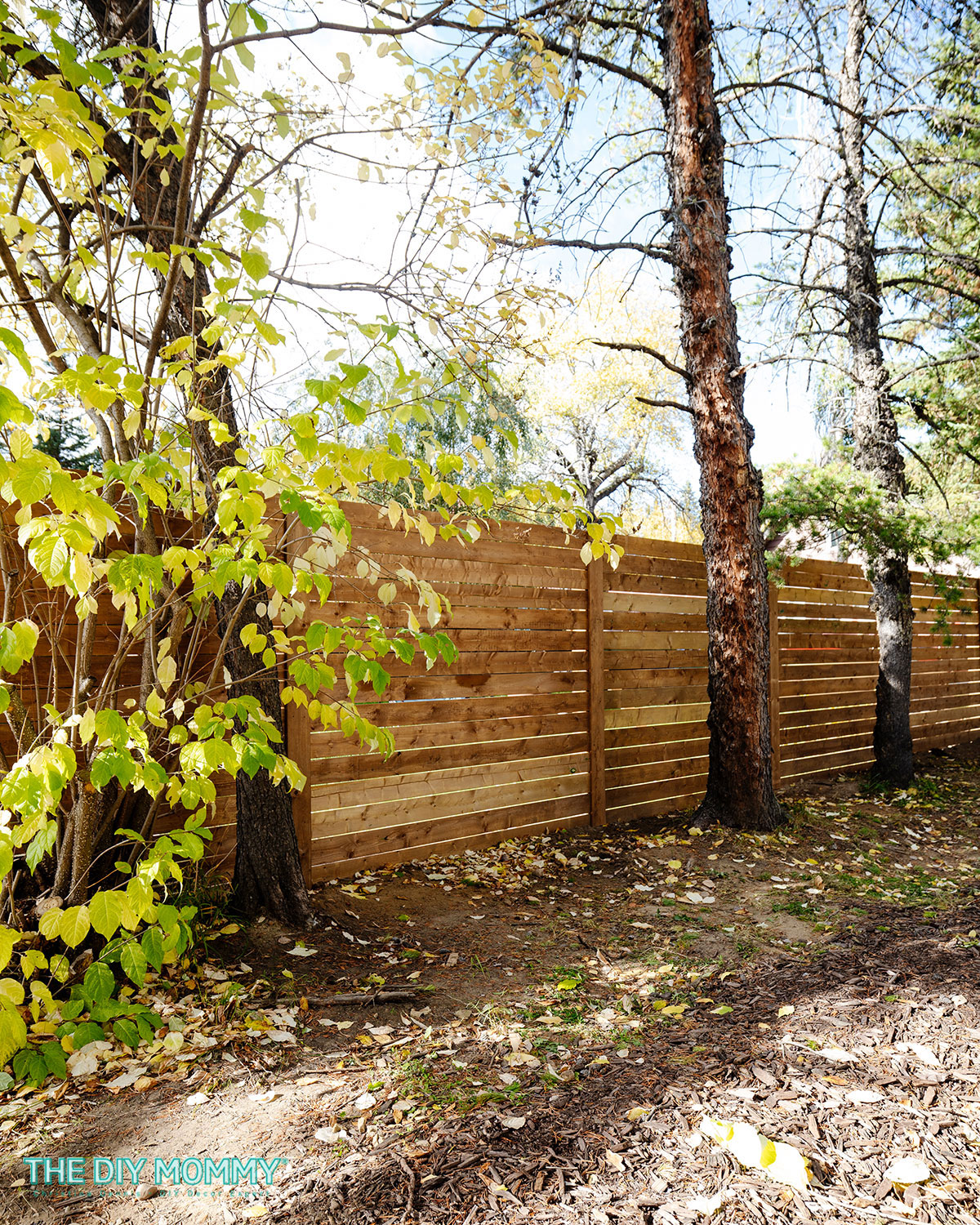 How We Built a Modern DIY Horizontal Slat Fence - Cozy DIY Home